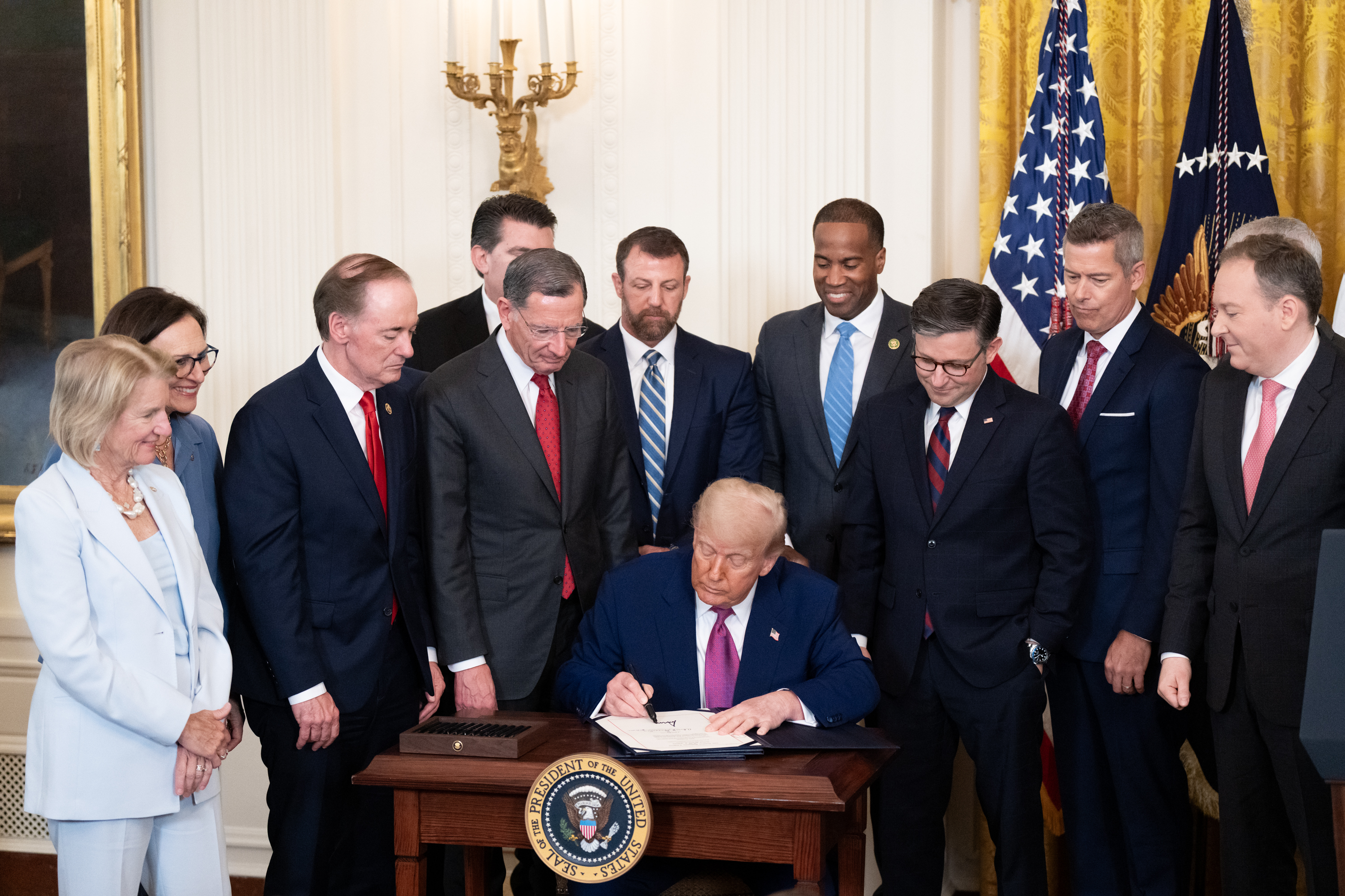 President Donald Trump delivers remarks at a bill signing ceremony ...