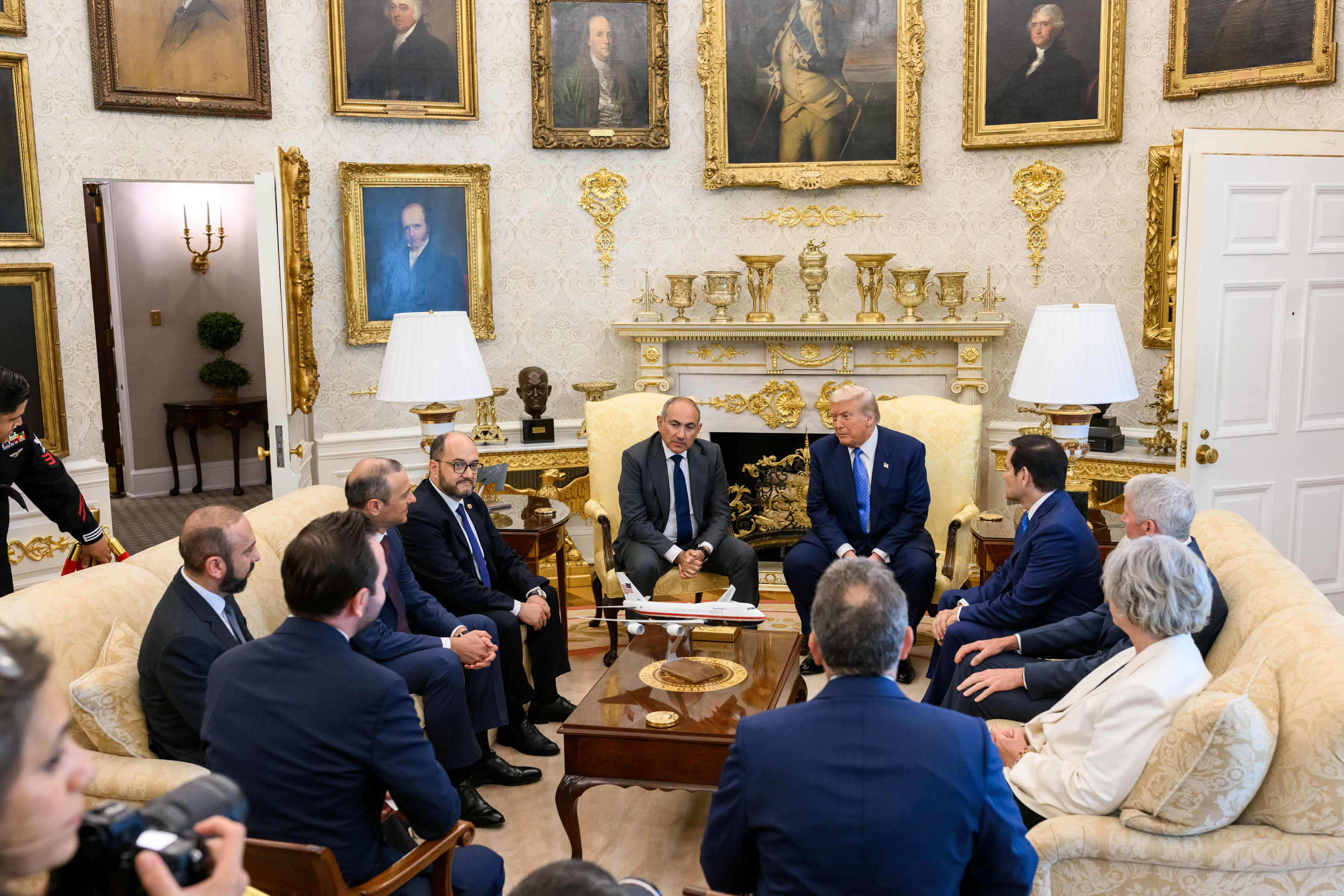 President Donald Trump signs a trilateral joint declaration with ...