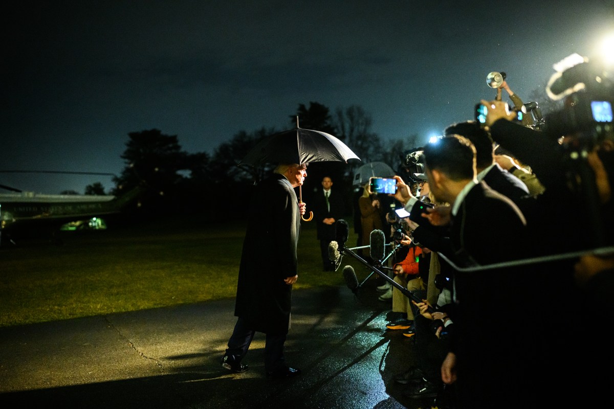 President Donald Trump speaks with members of the media before boarding ...